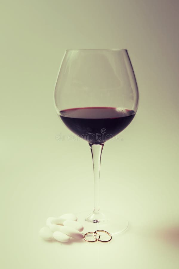 Red Wine with Wedding Rings Stock Image - Image of gold, confetti: 27011779