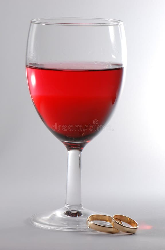 Red wine and wedding rings stock image. Image of drink - 4248571