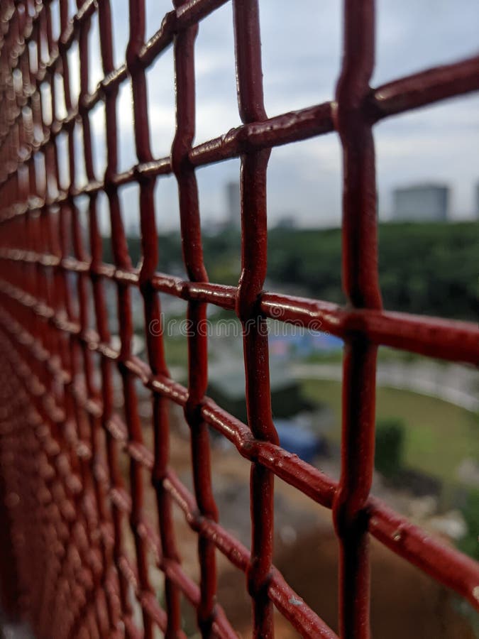 Red wire mesh of lift stock image. Image of fence, glass - 264796329