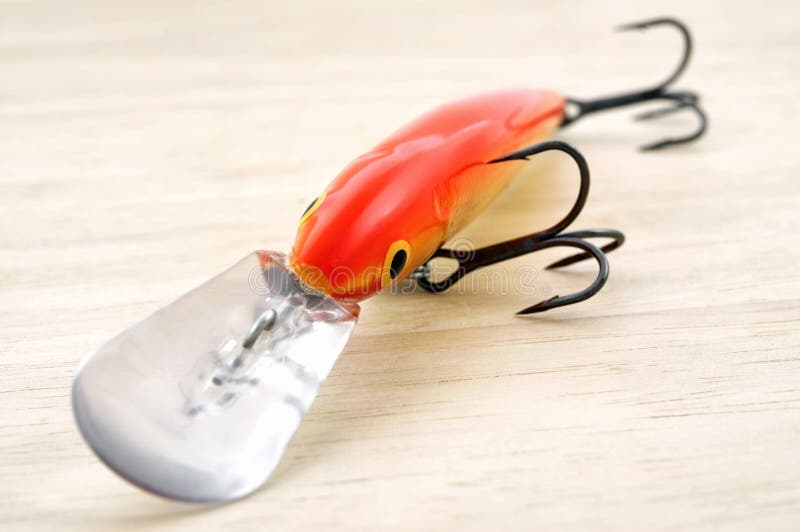 Wobbler on wooden desk stock photo. Image of predator - 29971600