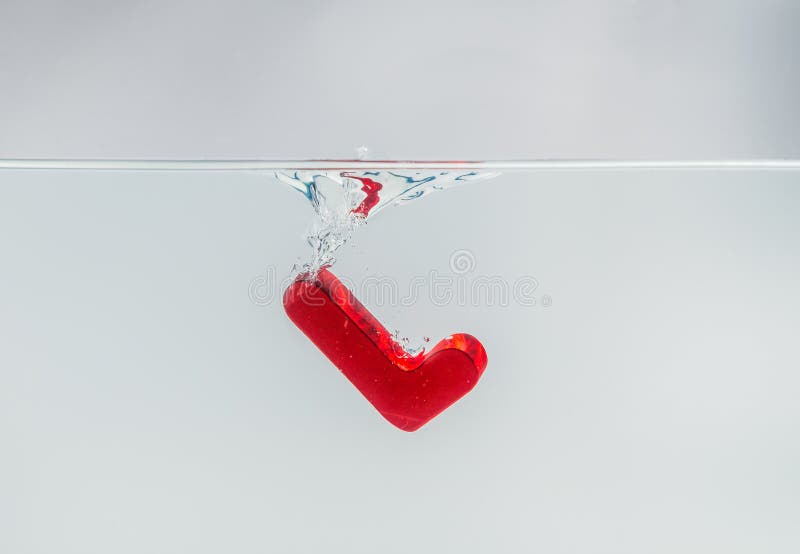 Red Wooden Alphabet L Drop in the Water with White Background and ...
