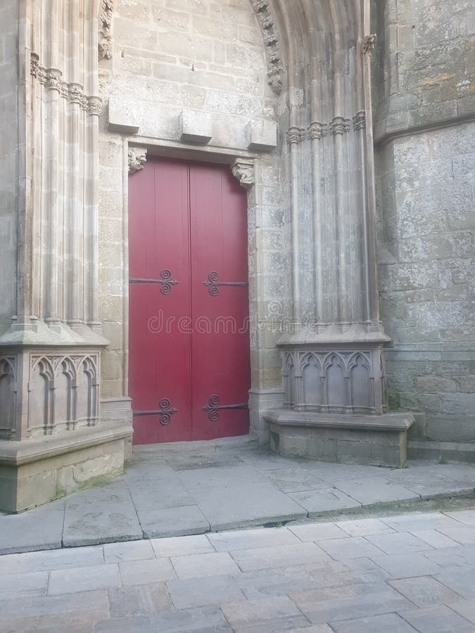 Red Wooden Doors with Metal Decor in a Medieval Building Stock Image ...