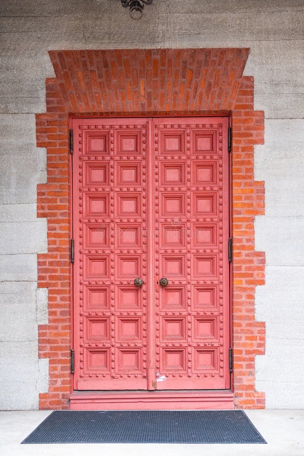 Red Wooden Double Gates in a Stone Wall Stock Image - Image of metal ...