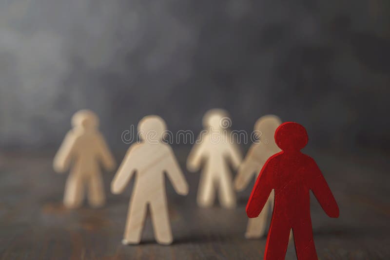 Red Wooden Figures Stand Out from the Crowd of Wooden Figures Stock ...