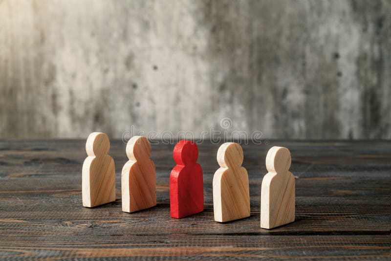 Red Wooden Figures Stand Out from the Crowd of Wooden Figures Stock ...