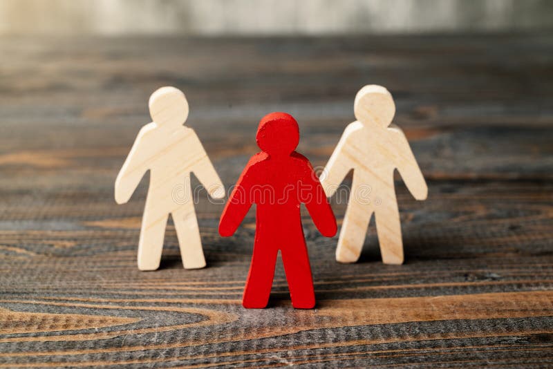 Red Wooden Figures Stand Out from the Crowd of Wooden Figures Stock ...