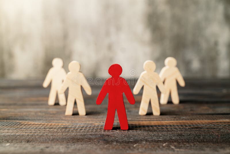 Red Wooden Figures Stand Out from the Crowd of Wooden Figures Stock ...