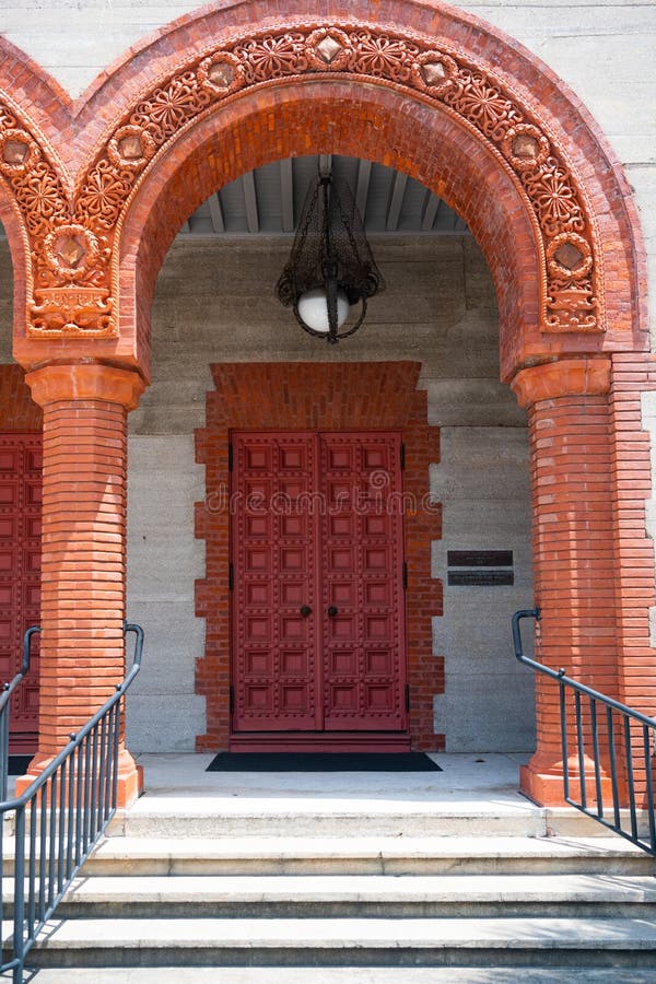 Red Wooden Gate in a Stone Wall with an Arch Stock Image - Image of ...