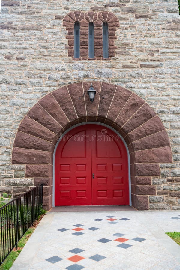 Red Wooden Gate in a Stone Wall with an Arch Stock Photo - Image of ...