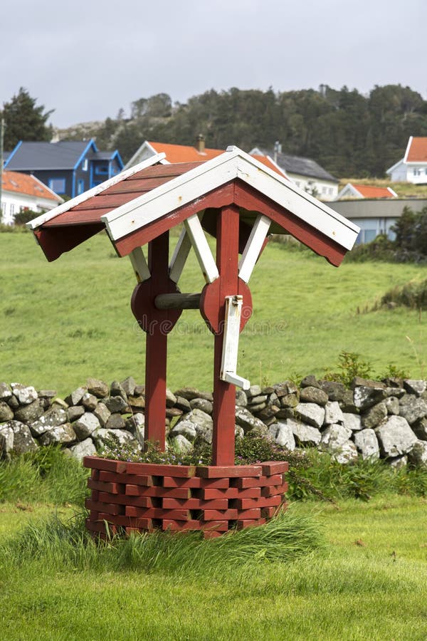 Red wooden well stock image. Image of grass, construction - 81058173