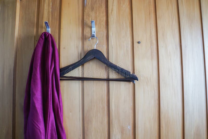 Red Wool Scarf with Cloth Hanger on Wooden Wall Stock Photo - Image of ...