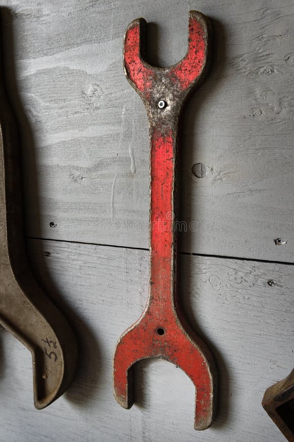 Red Wrench Spanner and Other Tools on Wall Stock Photo - Image of ...