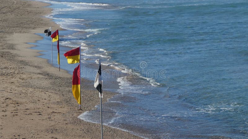 Beach Flags Along the Sand at the Beach Stock Image - Image of wave ...