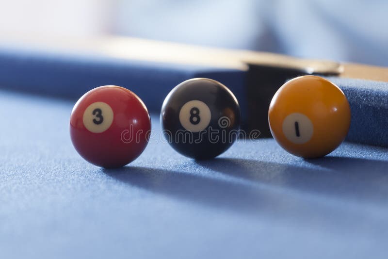 Red, Yellow and Black Billiard Balls in a Pool Table Stock Image ...