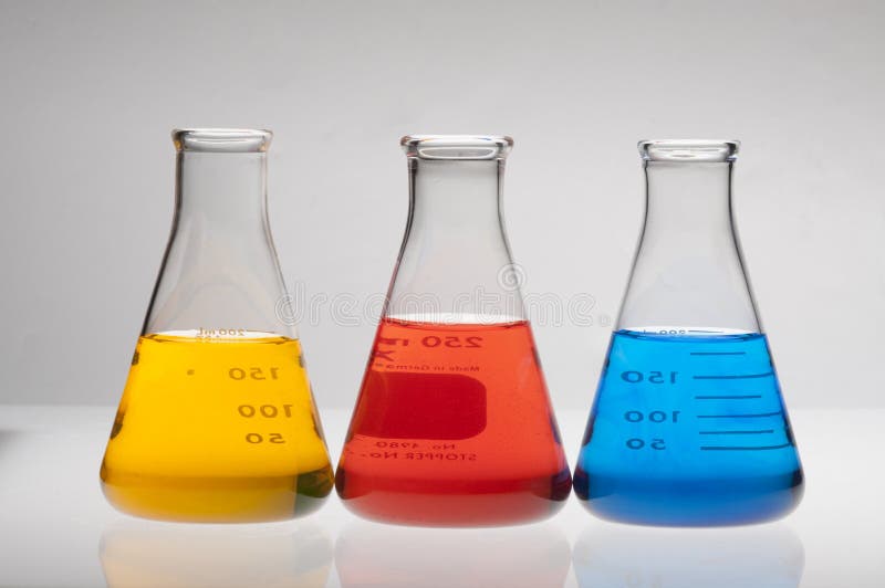 Red, Yellow and Blue Ehrlenmeyer Flasks Stock Photo - Image of blue ...