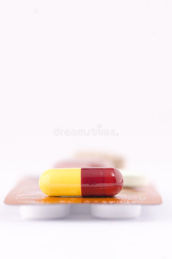 Red and Yellow Capsule on a Blister Stock Image - Image of shiny ...