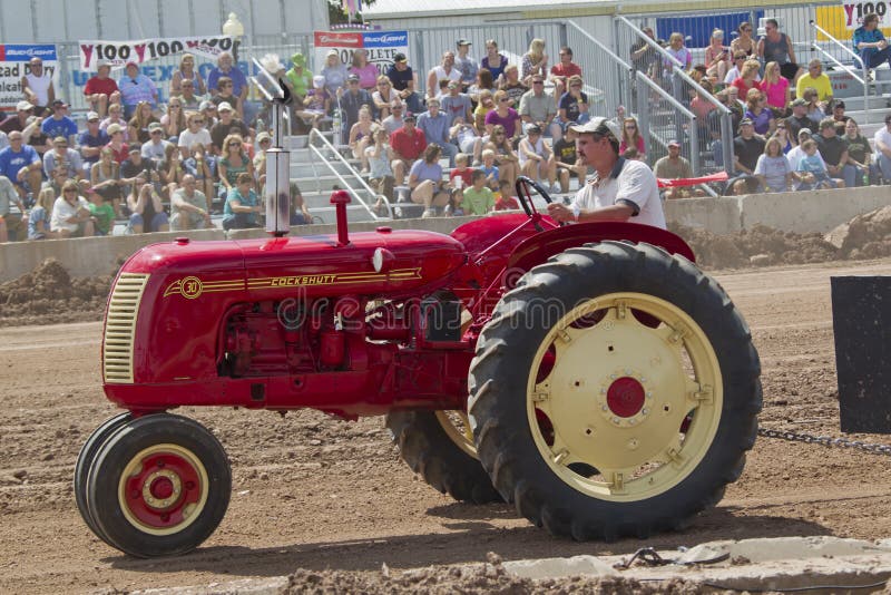 Red & Yellow Cockshutt Tractor Pulling Tracks Editorial Image - Image ...