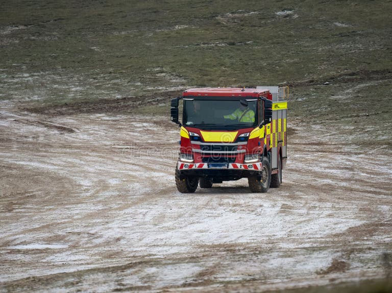Red and Yellow Fire Engine Driven Off Ro Stock Photo - Image of ...