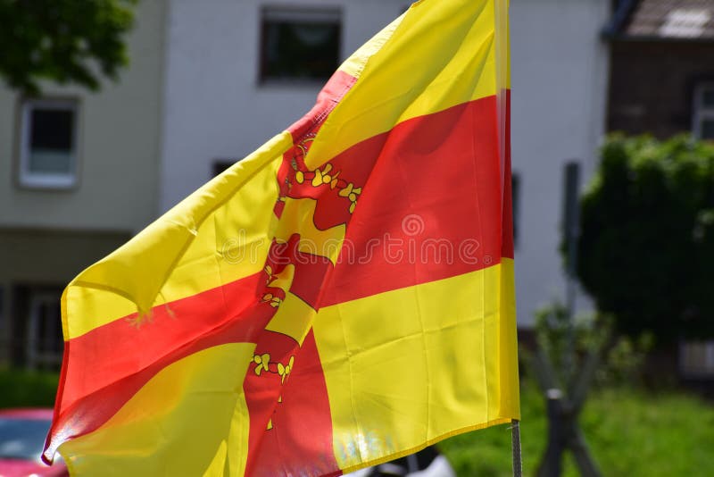 Yellow and Red Flag Waving in the Wind Stock Photo - Image of person ...