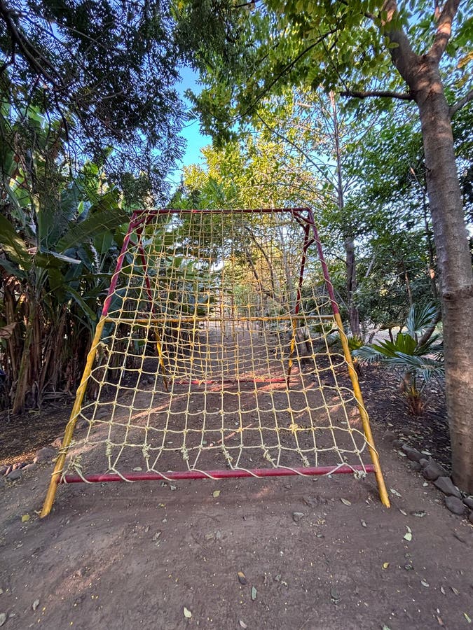A Red and Yellow Obstacle Course with a Net Stock Photo - Image of ...