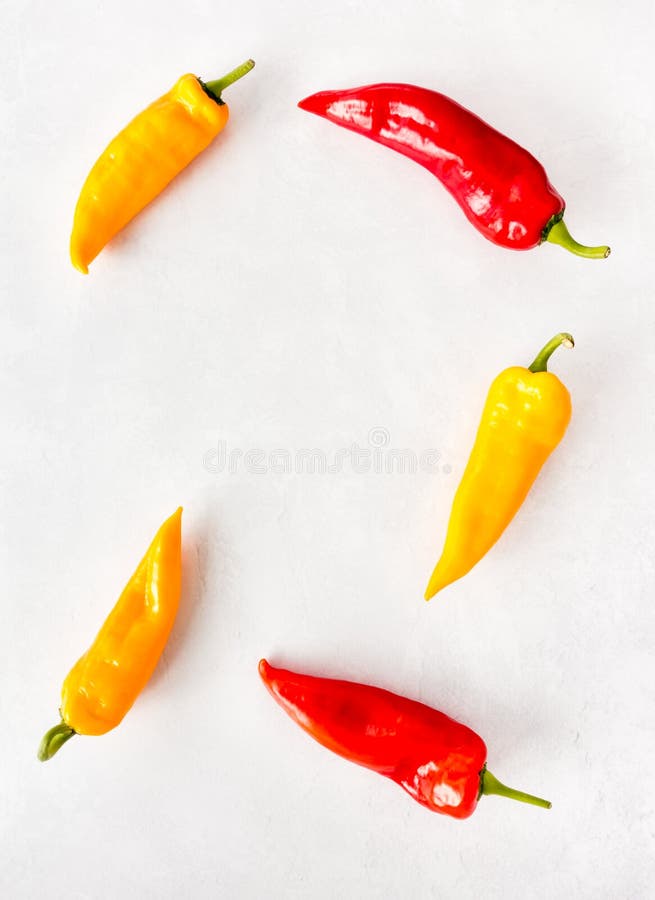 Red, Yellow and Orange Romano Peppers on Gray Background Stock Photo ...