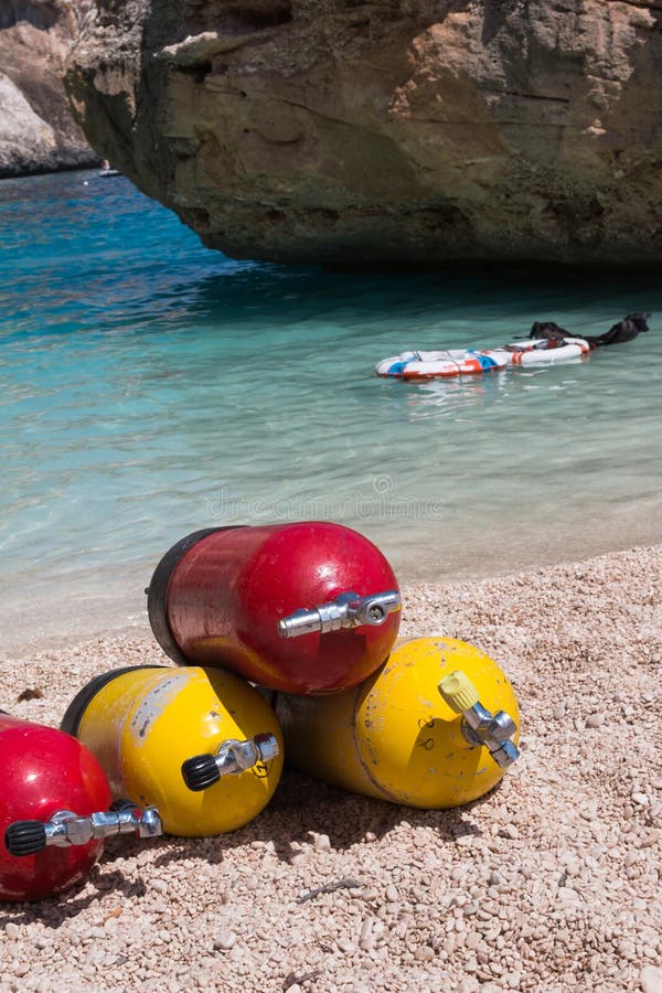 Red and Yellow Scuba Oxygen Tanks for Divers on a Beach Stock Photo ...