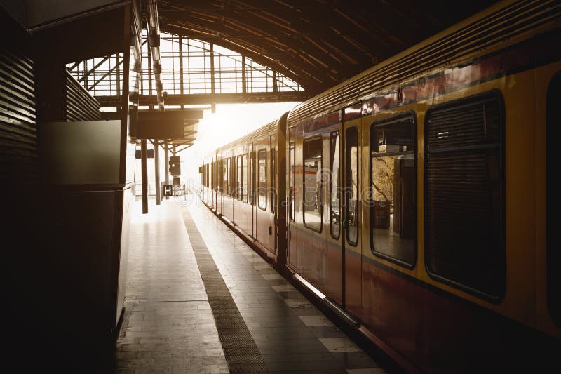 The Red and Yellow Train Stands on the Empty Platform of the Train ...