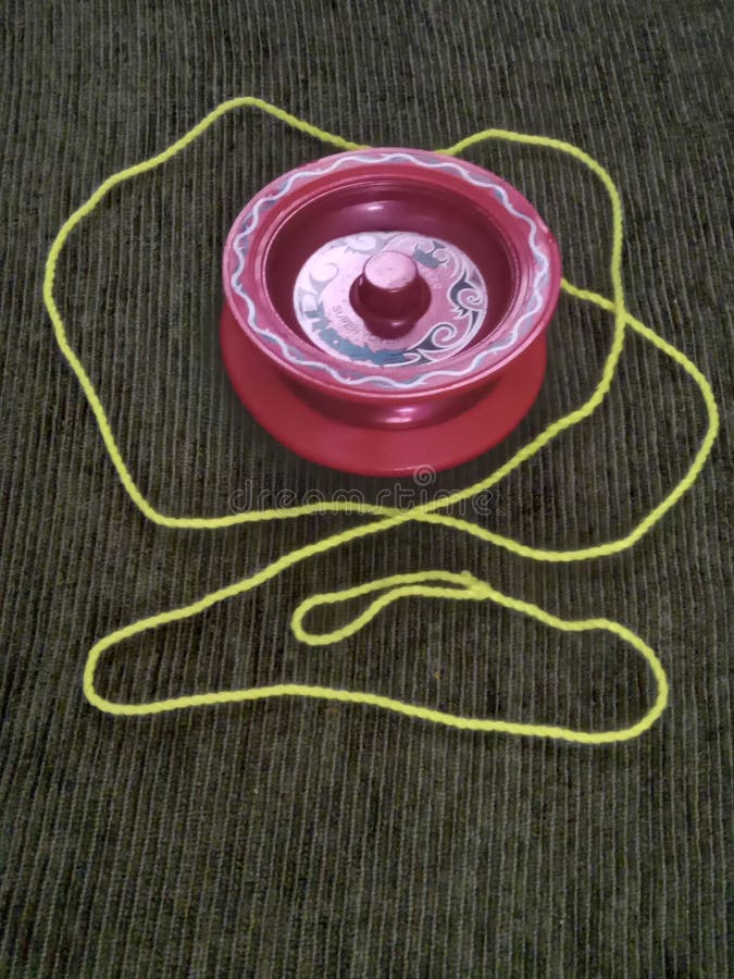 Red Yoyo on the Green Chair Stock Image - Image of yoyo, chair: 290498785