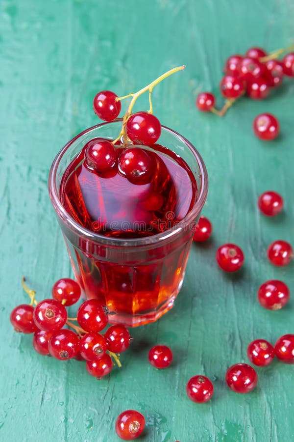 Red Currant Juice in Glass with Fruits on Wood Table Stock Image ...