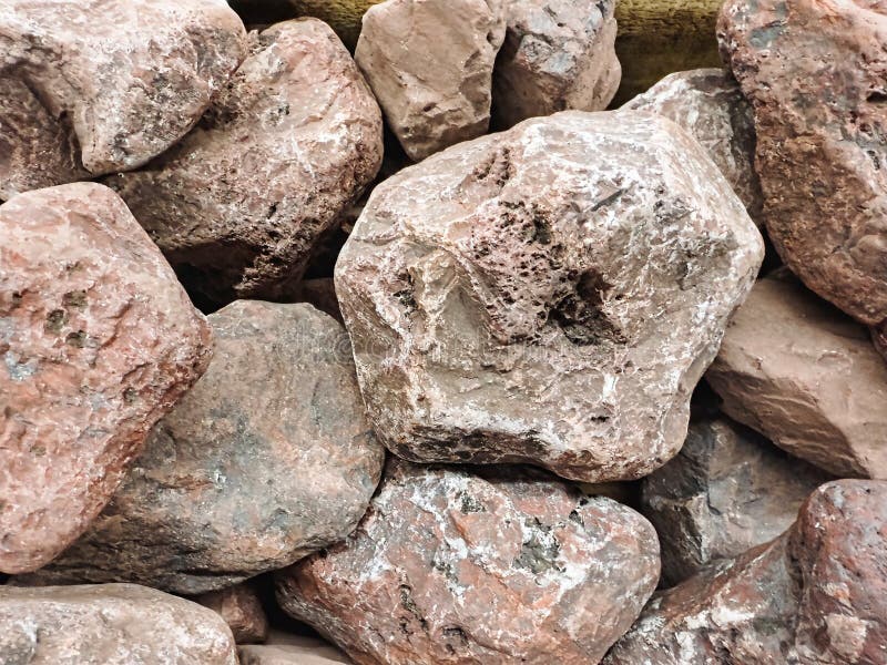 Reddish-brown Rocks in a Pile for Landscaping Uses and Construction in ...