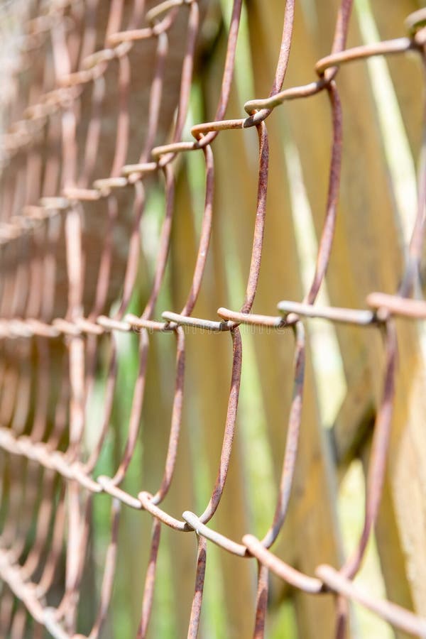 Reddish Chain Link Fence Seen from a Sharp Angle Stock Photo - Image of ...
