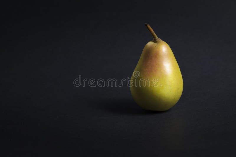 Reddish Pear on a Dark Gray Background Stock Image - Image of design ...