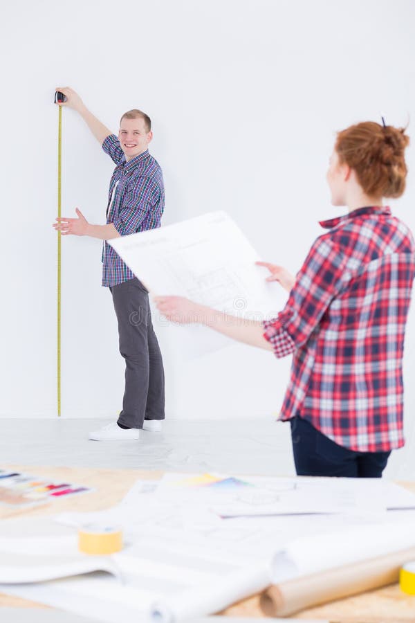 Redecorating is fun! stock image. Image of tape, couple - 73968647