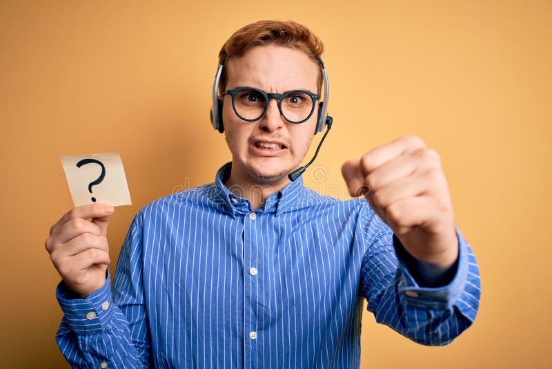 Redhead Call Center Agent Man Working Using Headset Holding Reminder ...