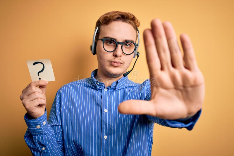 Redhead Call Center Agent Man Working Using Headset Holding Reminder ...