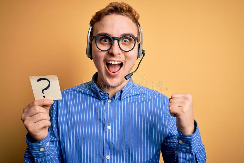 Redhead Call Center Agent Man Working Using Headset Holding Reminder ...