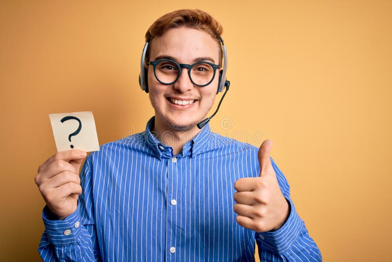 Redhead Call Center Agent Man Working Using Headset Holding Reminder ...