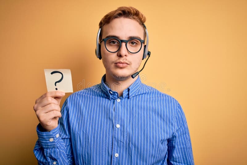 Redhead Call Center Agent Man Working Using Headset Holding Reminder ...