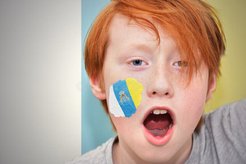 Redhead Fan Boy with Canarian Flag Painted on His Face Stock Image ...