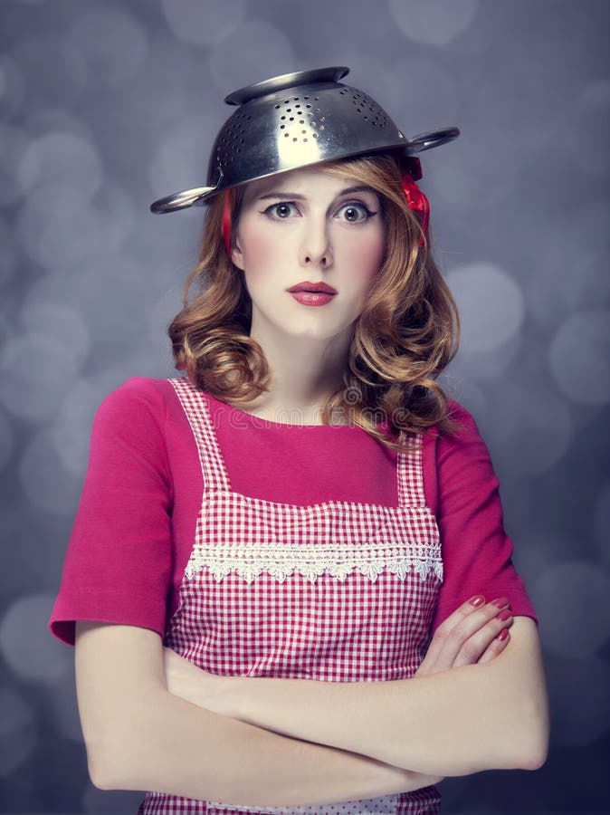 Redhead Housewife with Colander Over Head Stock Photo - Image of meal ...