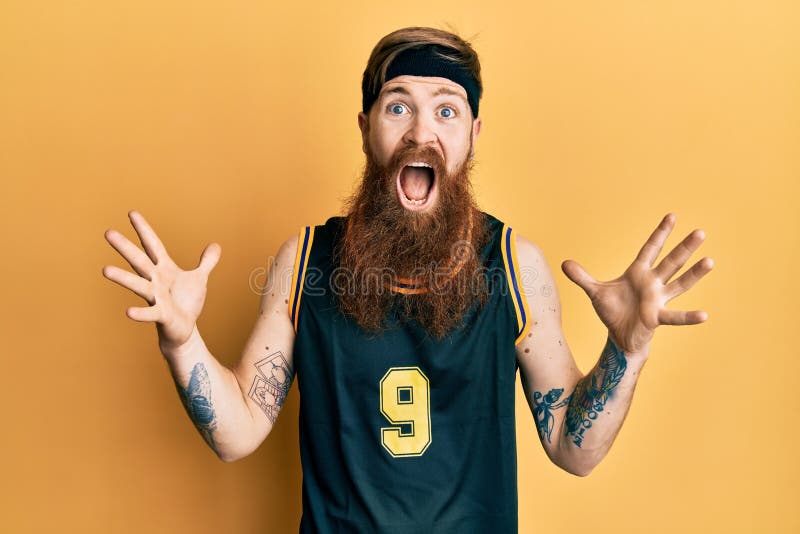 Redhead Man With Long Beard Wearing Basketball Uniform Celebrating