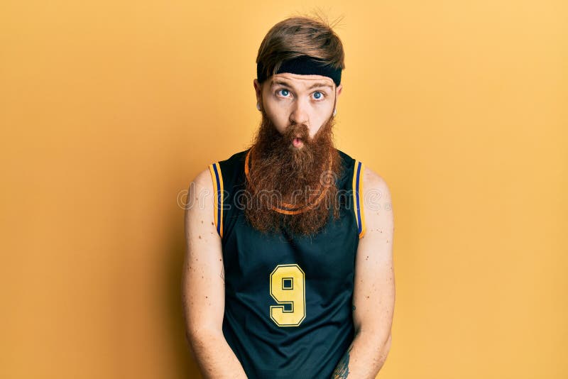 Redhead Man with Long Beard Wearing Basketball Uniform Making Fish Face ...