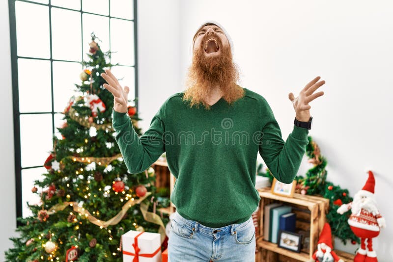 Redhead Man with Long Beard Wearing Christmas Hat by Christmas Tree ...