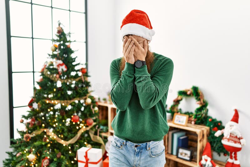 Redhead Man with Long Beard Wearing Christmas Hat by Christmas Tree ...