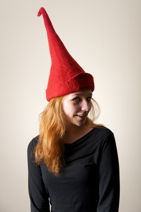 Redhead in Red Pointed Hat Turning Head Stock Photo - Image of woman ...