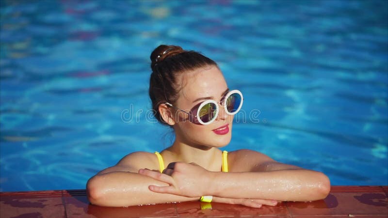 Redhead Woman Relaxing In The Pool She Standing On The Side Of