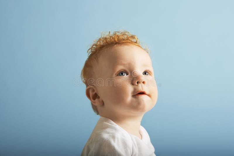 Portrait of Red Headed Baby Looking Up Stock Image - Image of infant ...
