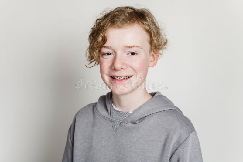 Redheaded Teen Boy with Grey Shirt on Studio Stock Photo - Image of ...