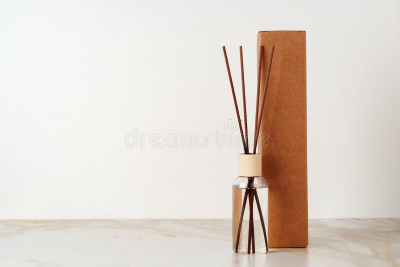 Reed Diffuser Bottle and Cardboard Box on White Marble Surface Stock ...