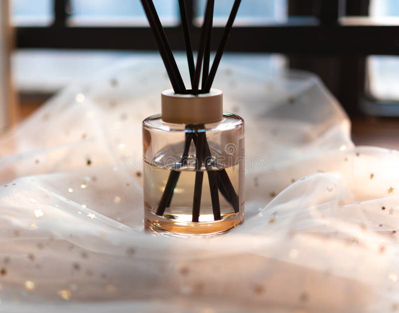 Reed Diffuser in Glass Bottle Placed on Beautiful Gauze Decorated with ...